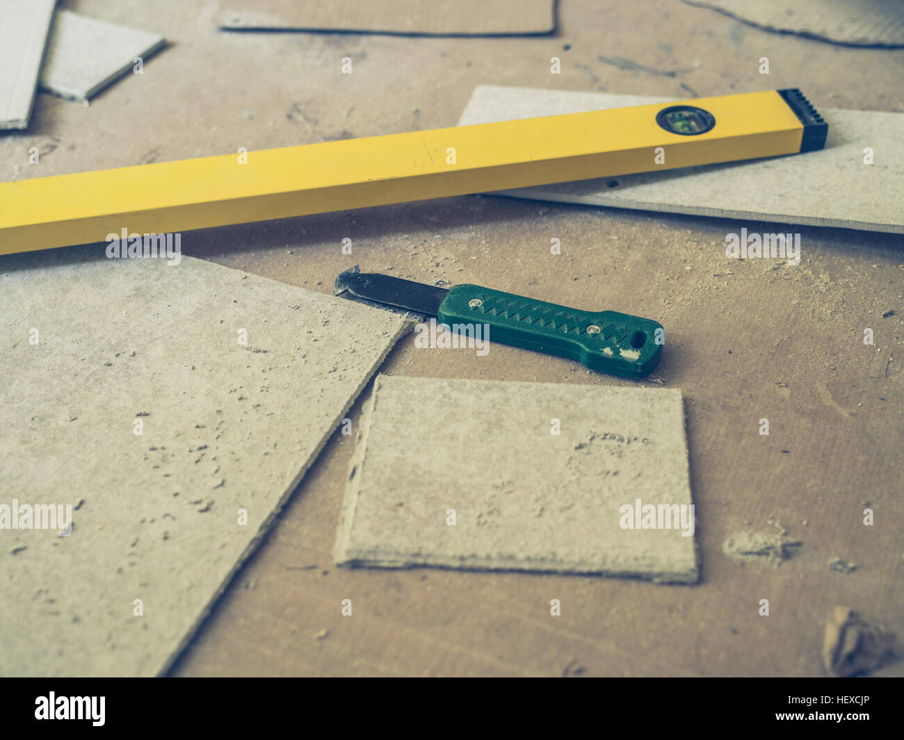 A sheet of cement board and the tools used to cutting it Stock Photo ...