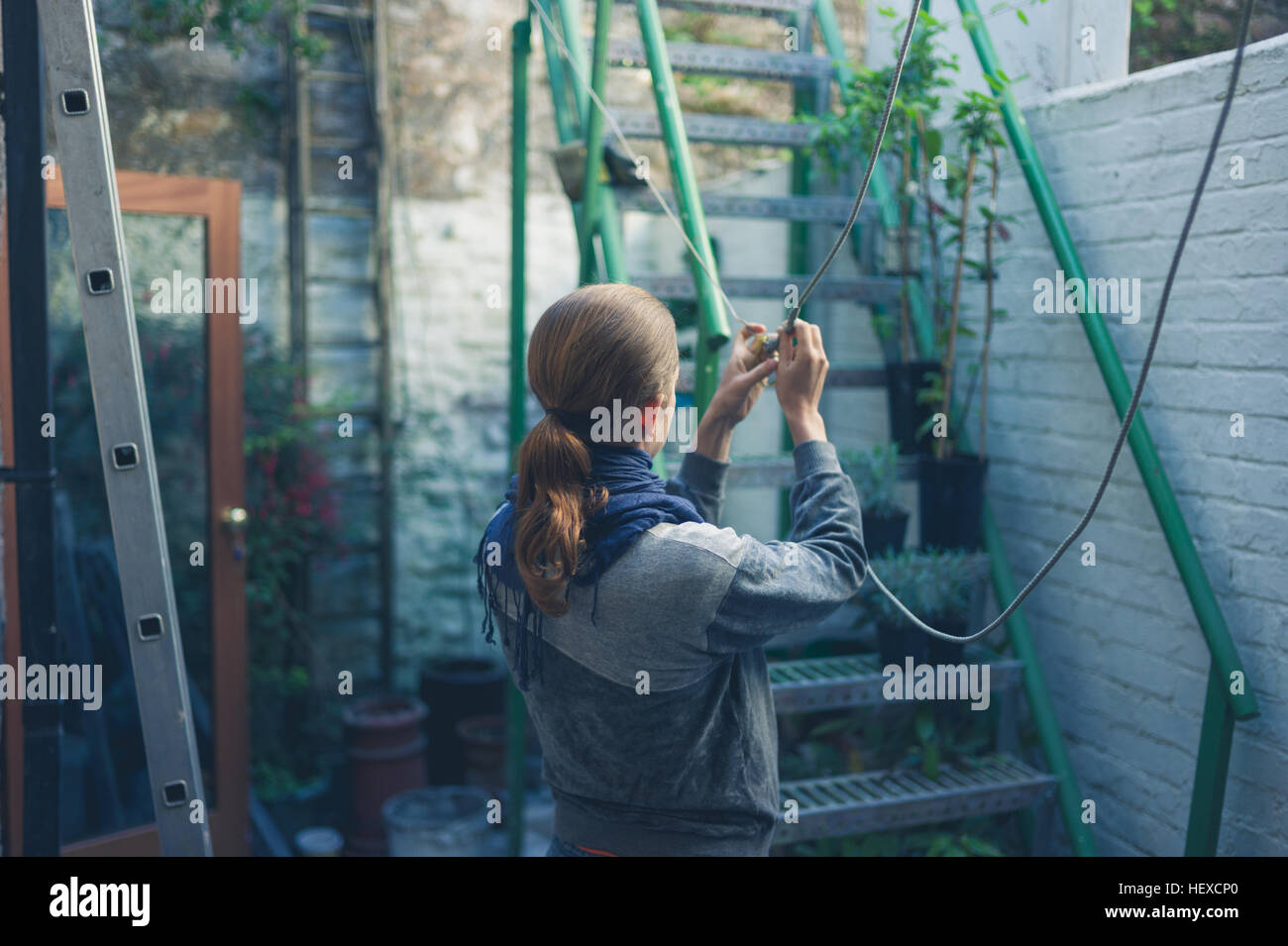 Woman washing clothes outside house hi-res stock photography and images ...