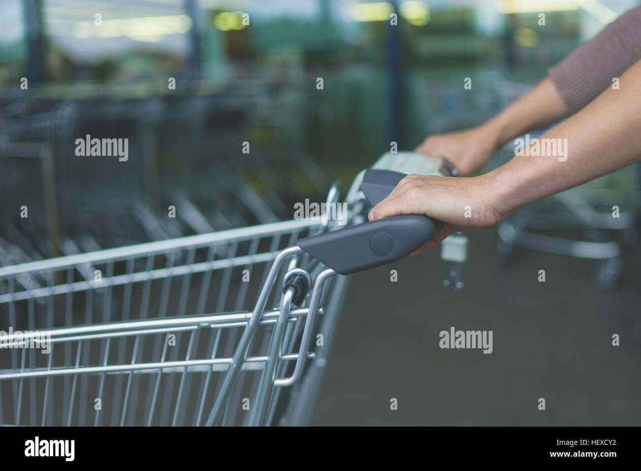 Pushing a shopping trolley hi-res stock photography and images - Alamy