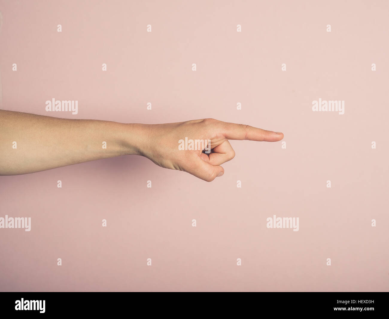 A young female hand is pointing Stock Photo - Alamy