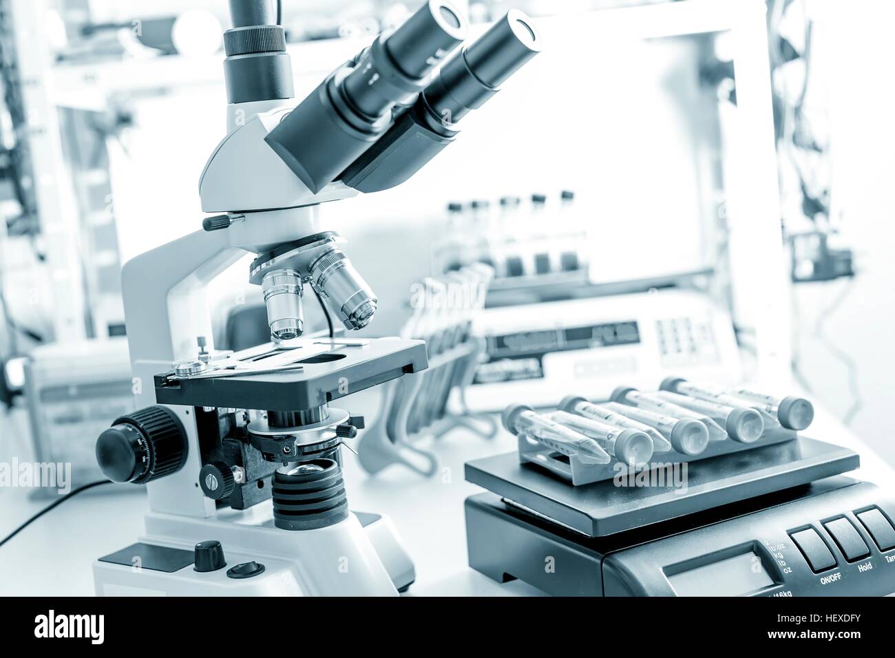 Microscope and test tubes in the laboratory Stock Photo - Alamy