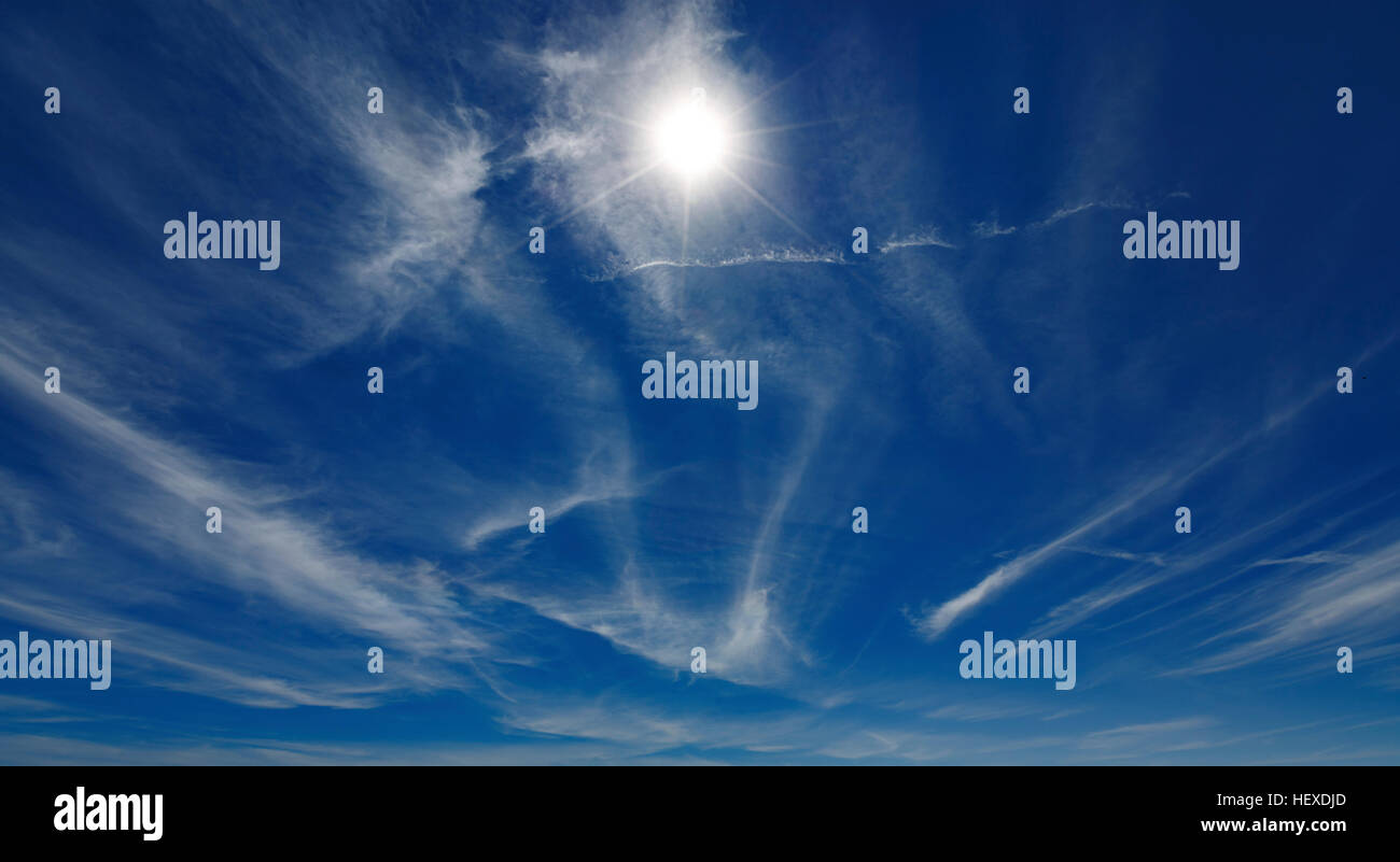 Bright sun in blue sky Stock Photo - Alamy