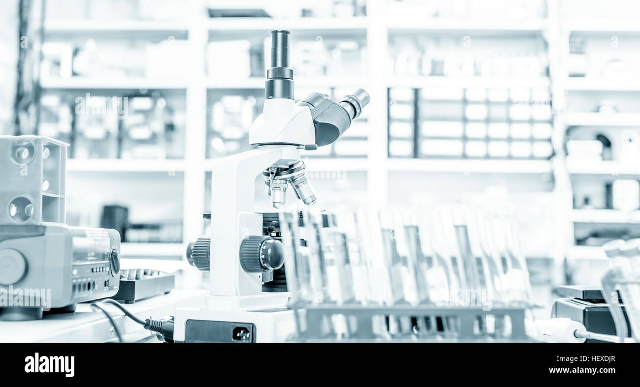 Microscope and test tubes in the laboratory Stock Photo - Alamy