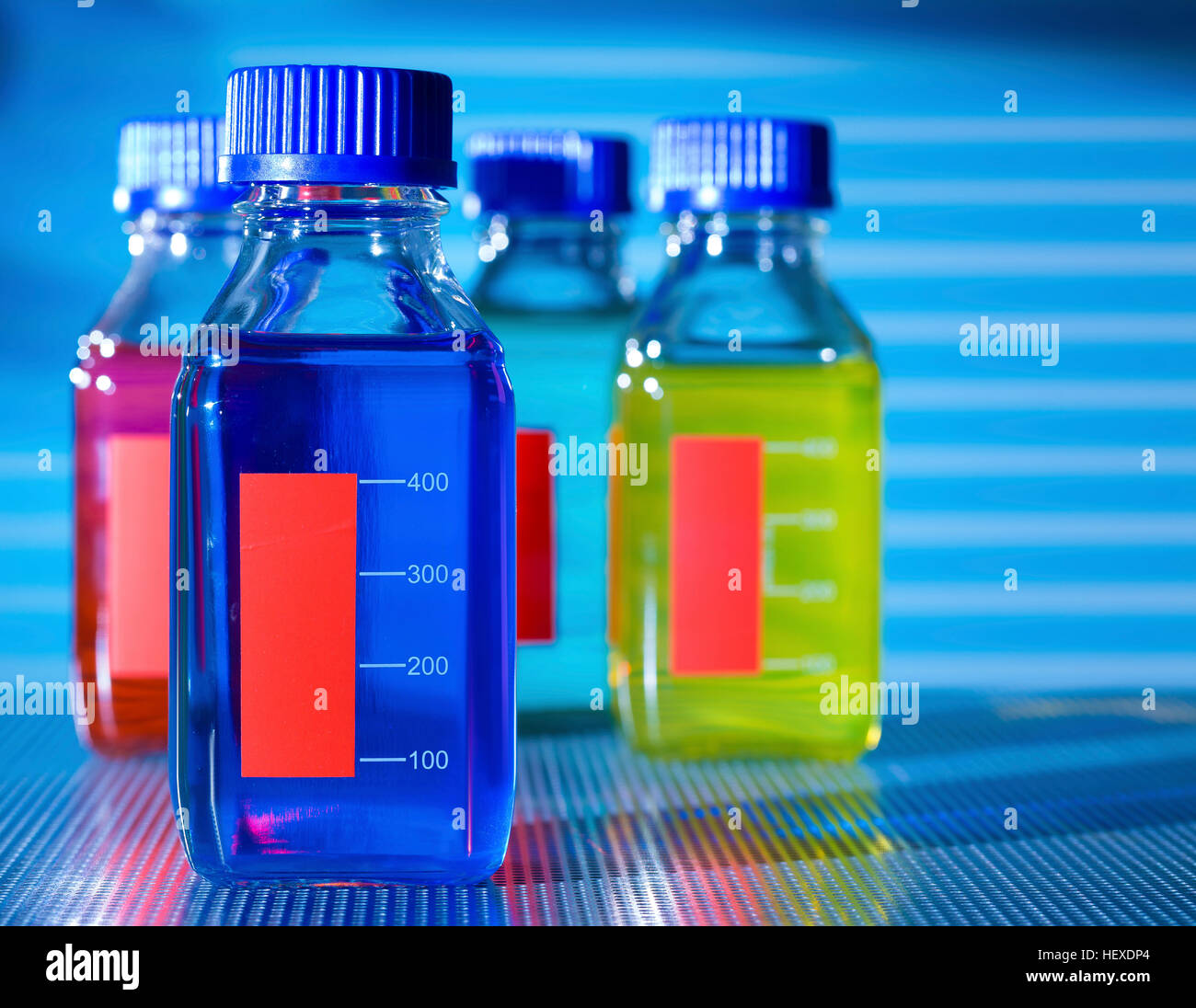 Bottles containing coloured liquid Stock Photo - Alamy