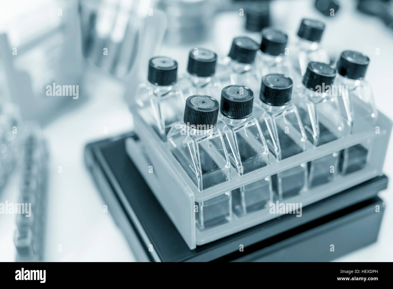 Glass bottles in a rack in the laboratory Stock Photo - Alamy