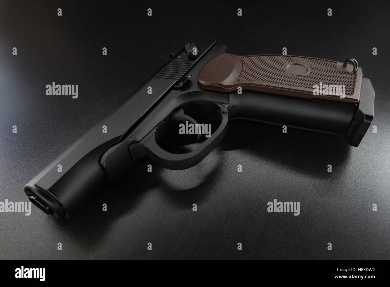 Handgun against a black background Stock Photo - Alamy