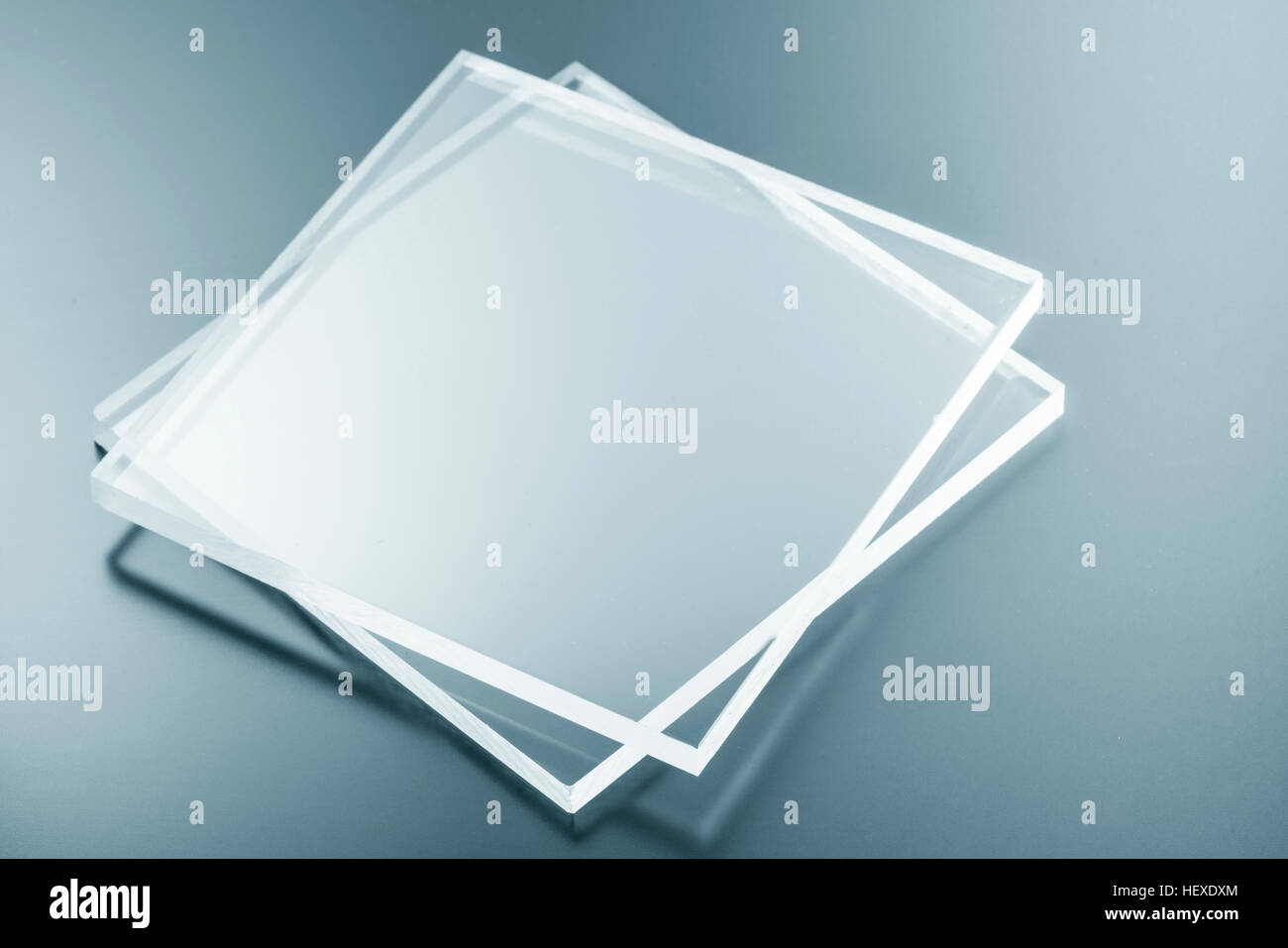 Sheets of glass against a plain background Stock Photo - Alamy