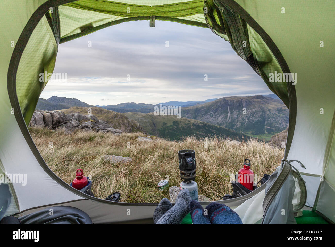 Room with a view - Wild camping couple pair of feet, looking out of ...