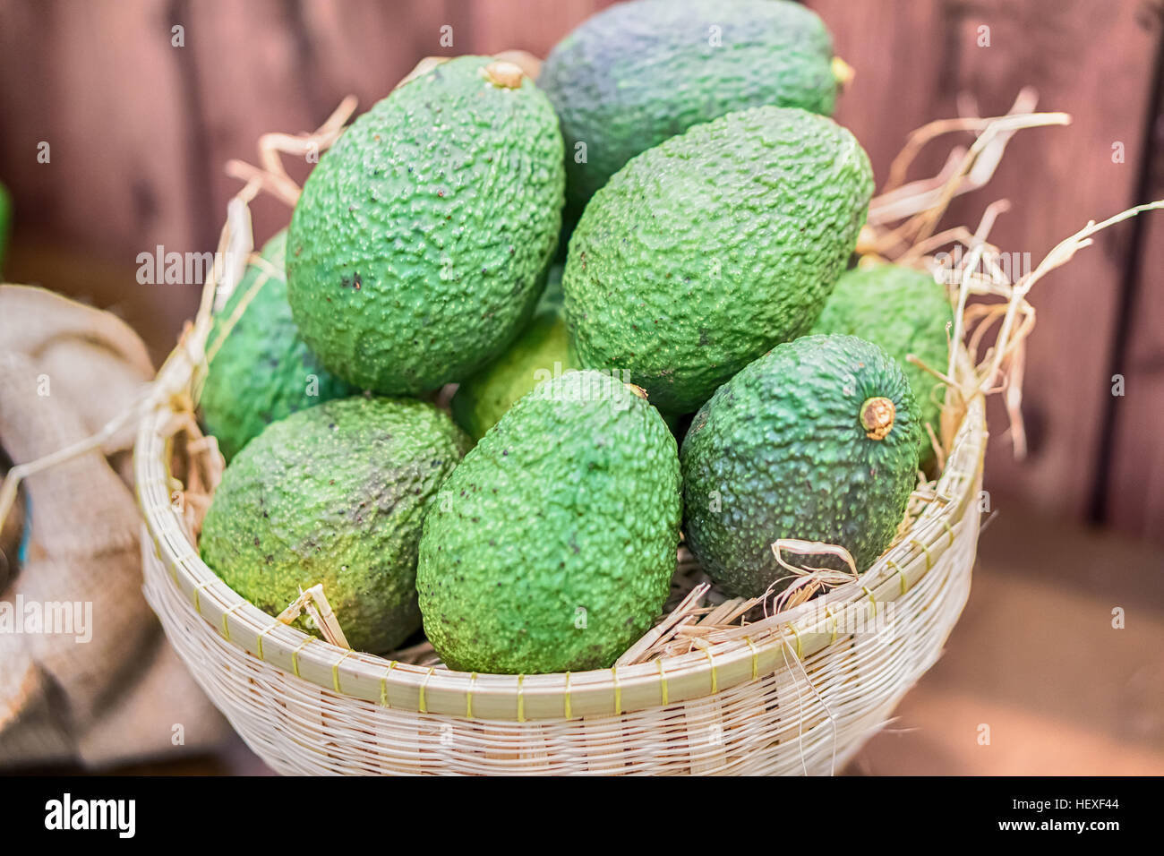 Avocado background. Fresh green avocado on a market stail. Food ...