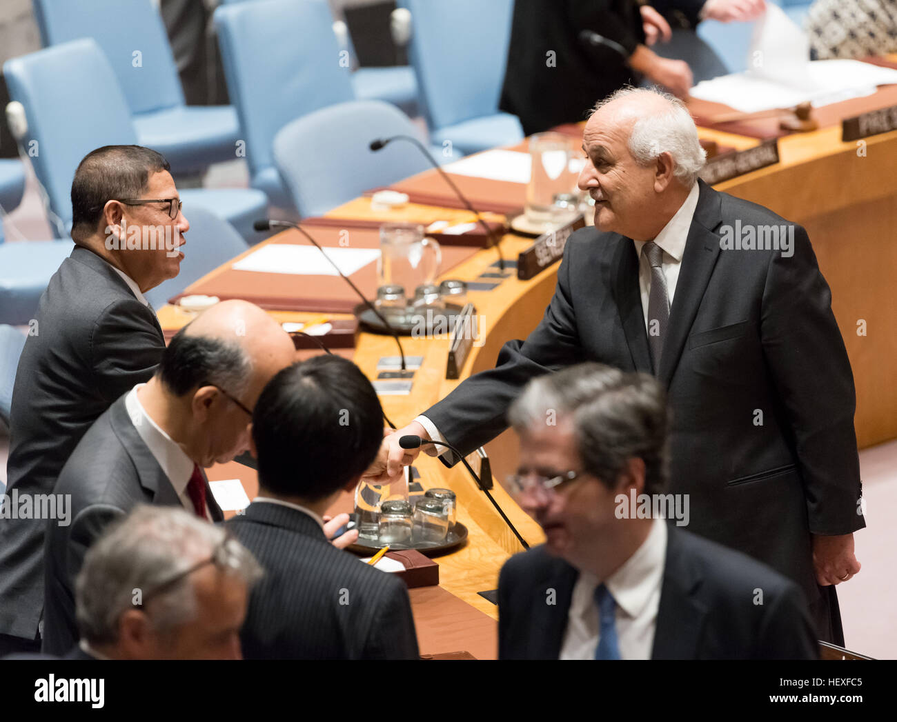 Palestinian Permanent Observer to the UN Riyad Mansour (R) greets ...