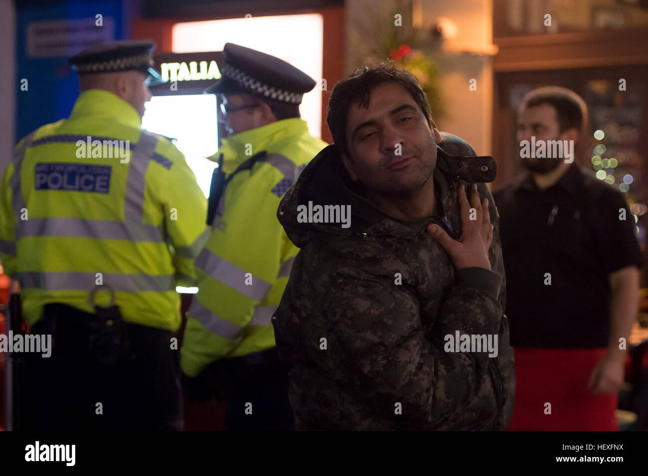A reveller in Leicester square on the last Friday before Christmas ...