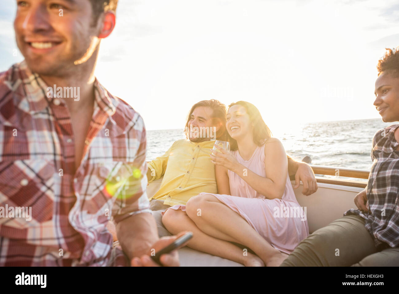 Happy friends hanging out on a boat trip Stock Photo - Alamy