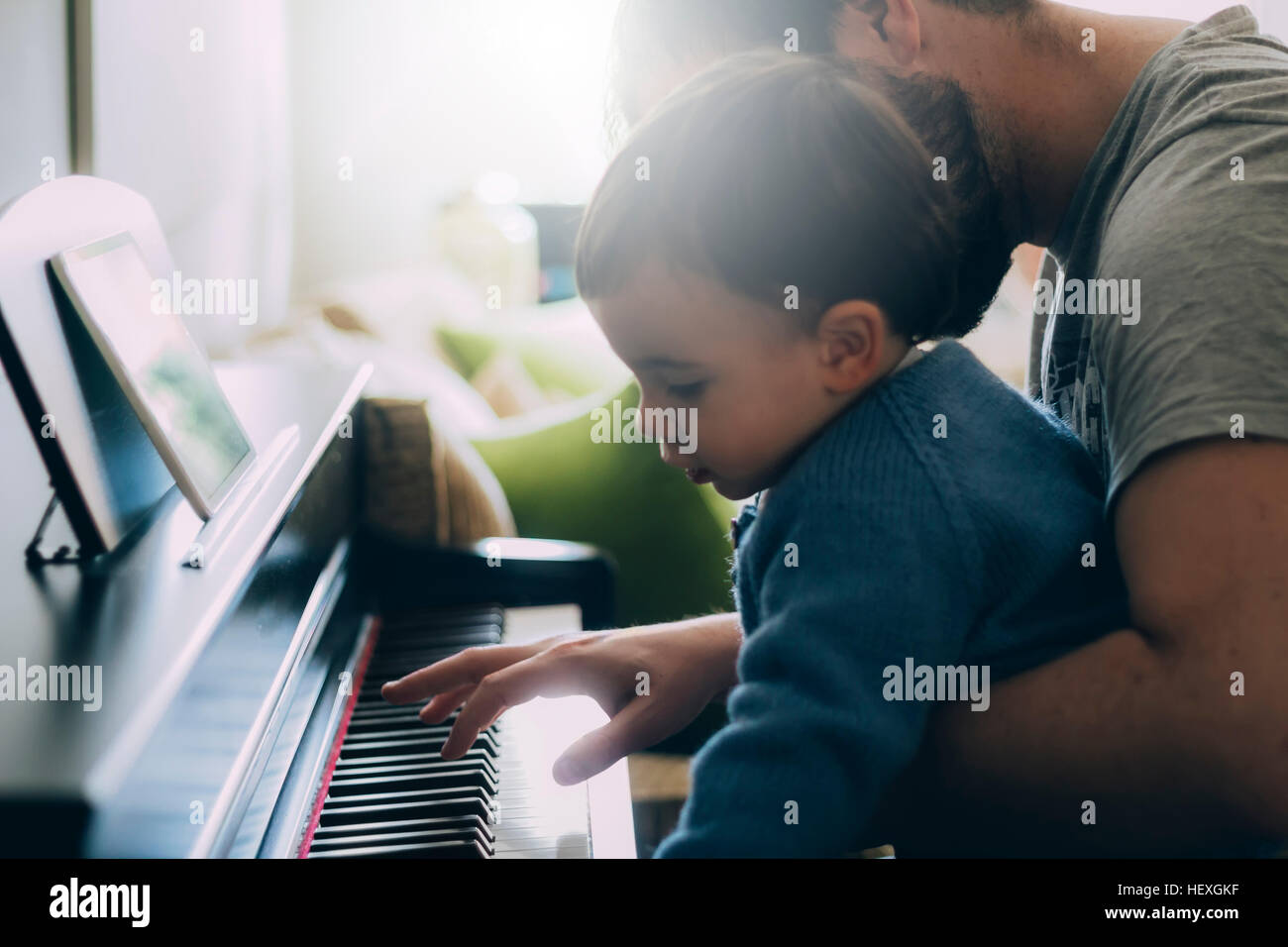 Child and his father playing piano Stock Photo - Alamy