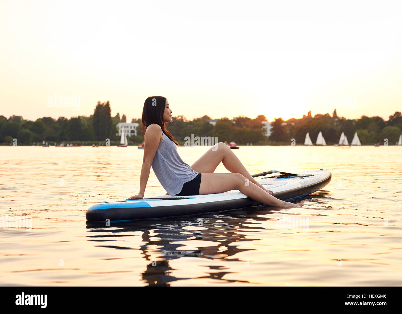 Asian woman on paddleboard hi-res stock photography and images - Alamy