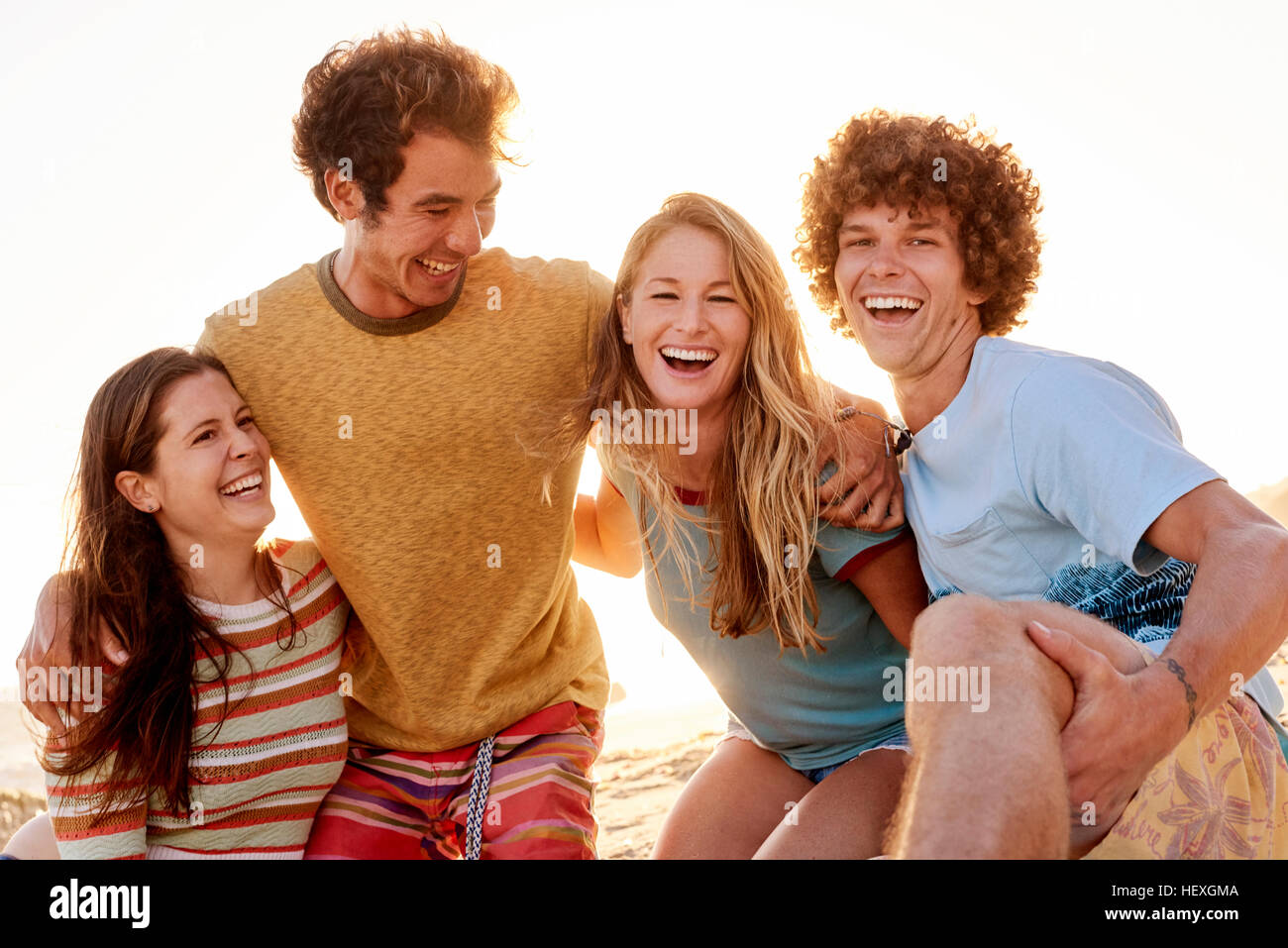 Happy friends on the beach Stock Photo - Alamy