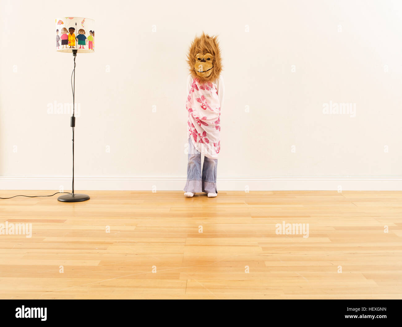 Girl wearing monkey mask Stock Photo - Alamy