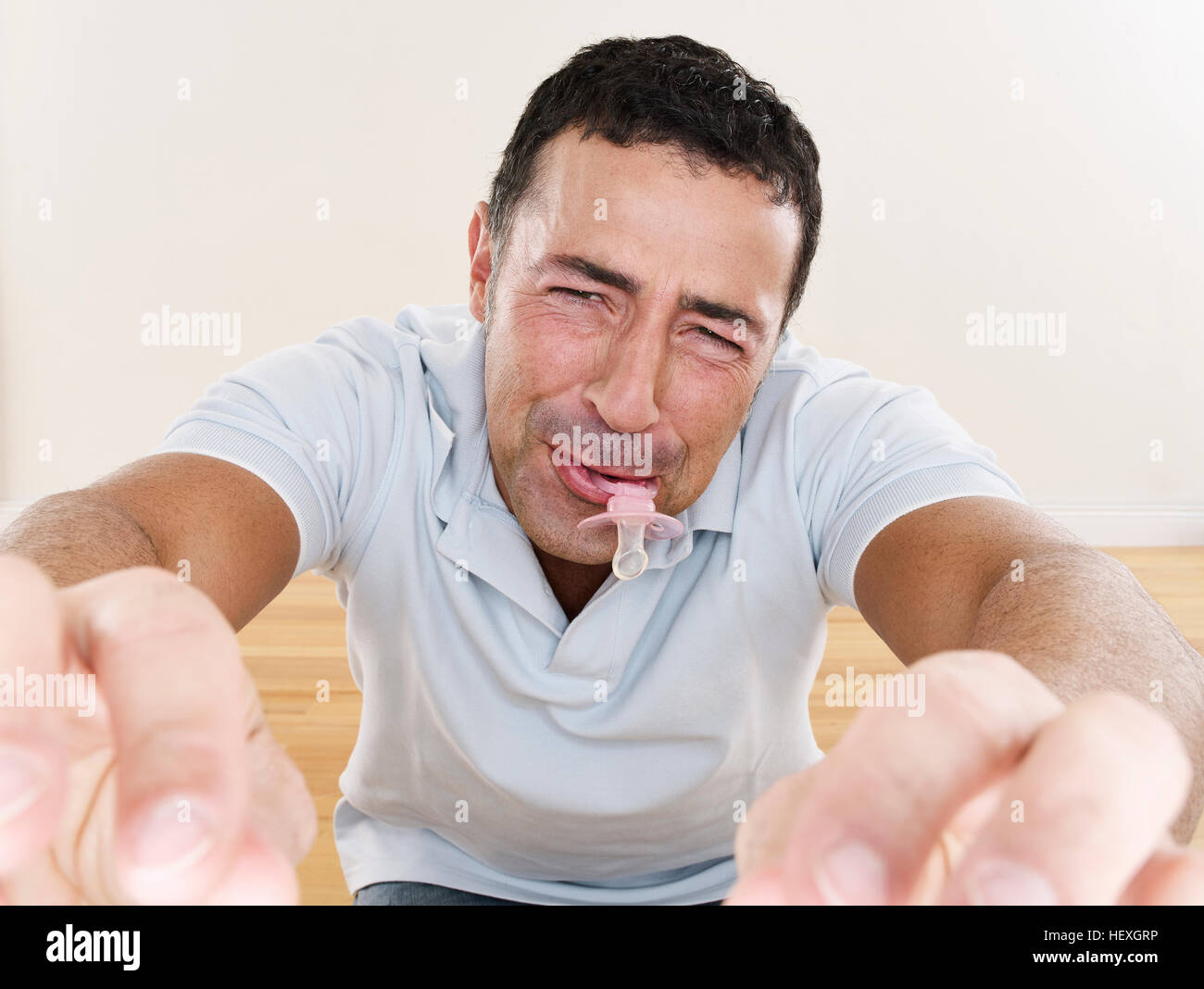 Portrait of man with pacifier Stock Photo - Alamy