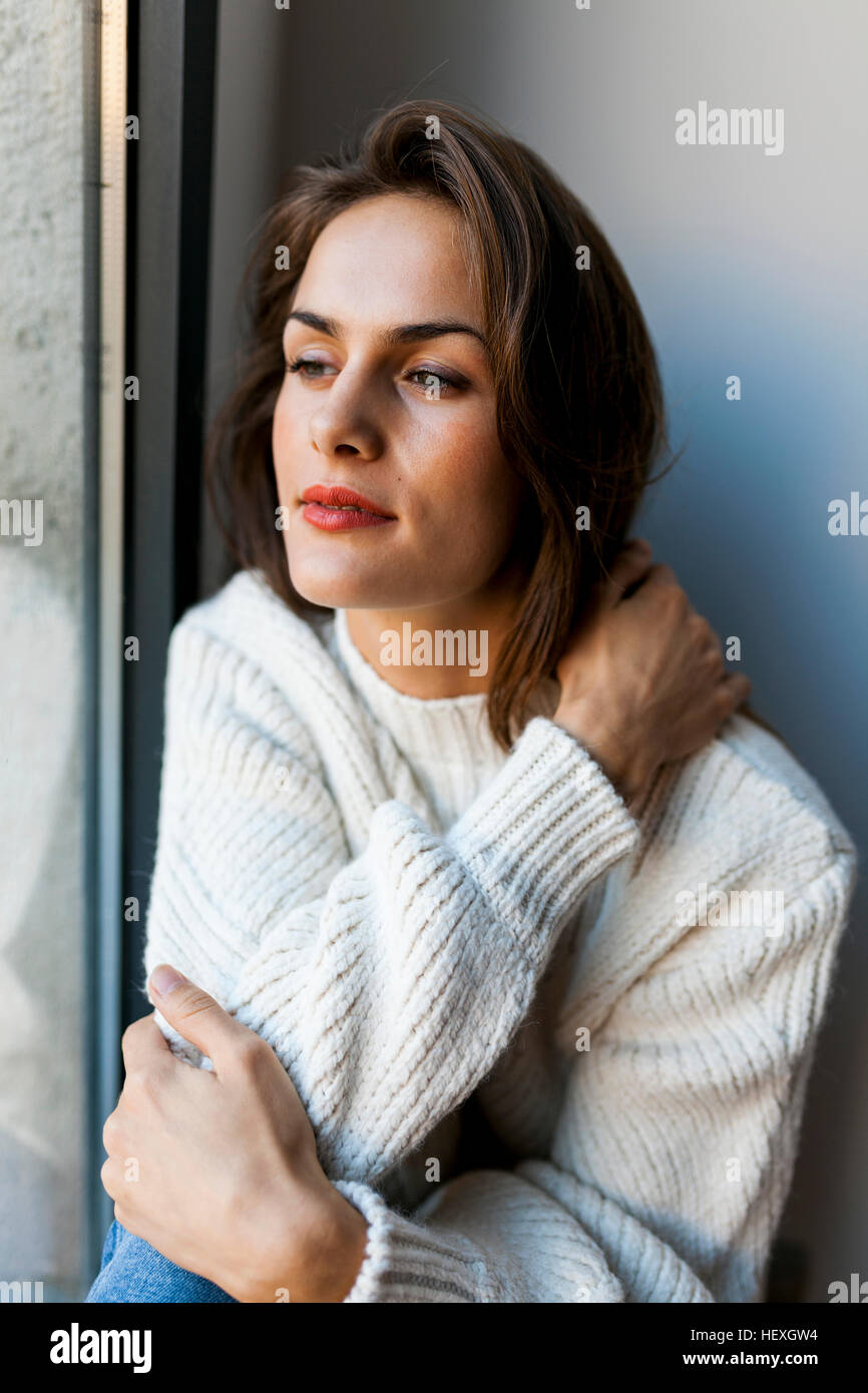 Young woman at a window looking out Stock Photo - Alamy Young woman at a window looking out Stock Photo - Alamy
