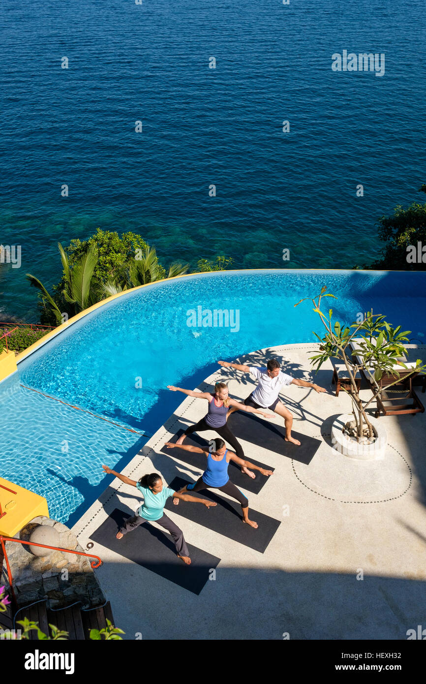 View from above at yoga group on ocean front property Stock Photo - Alamy