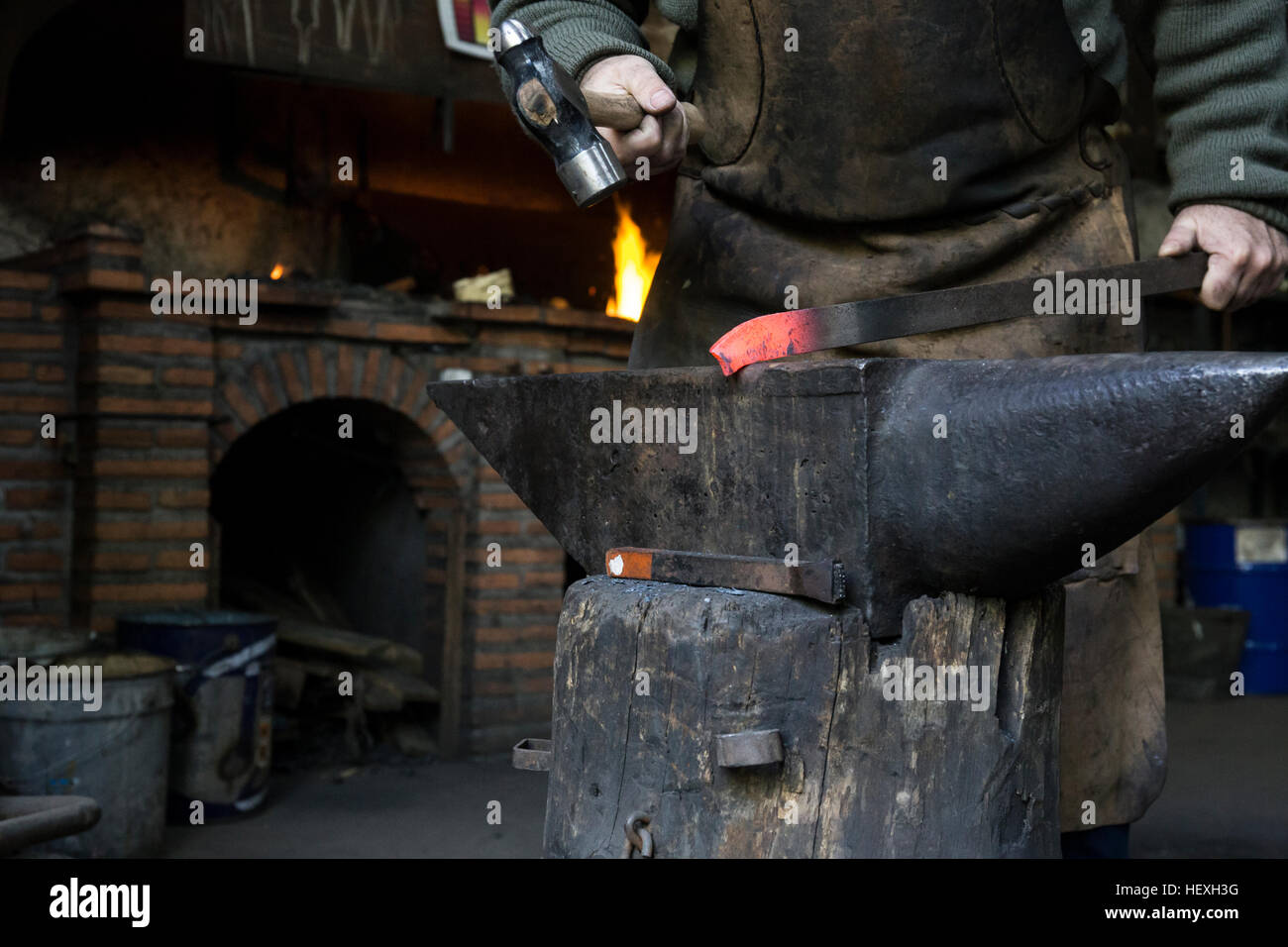 Blacksmith at work in his workshop Stock Photo - Alamy