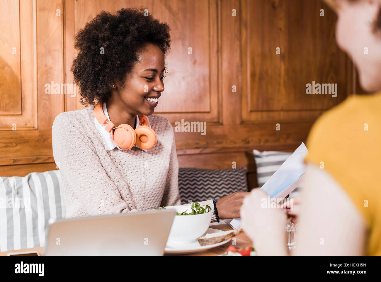 Two young women in a cafe Stock Photo - Alamy