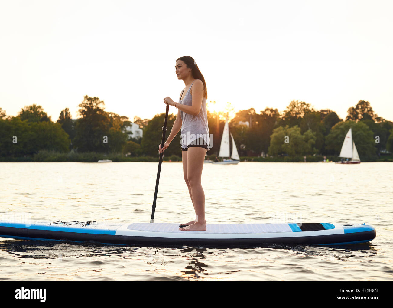 Asian woman paddleboard hi-res stock photography and images - Alamy