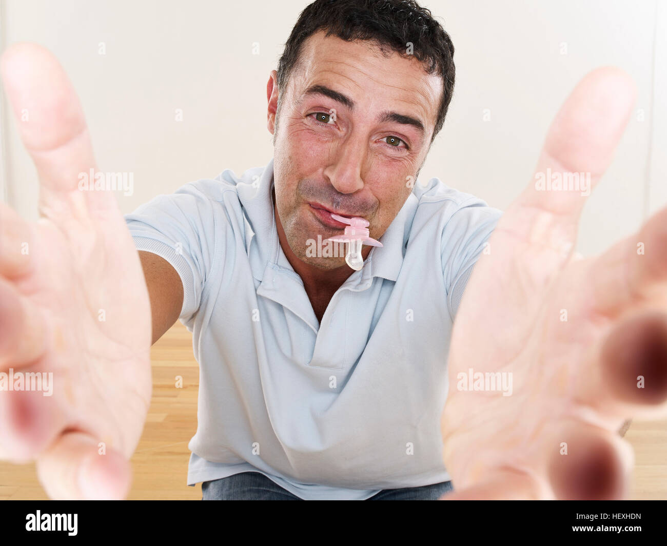 Portrait of man with pacifier Stock Photo - Alamy