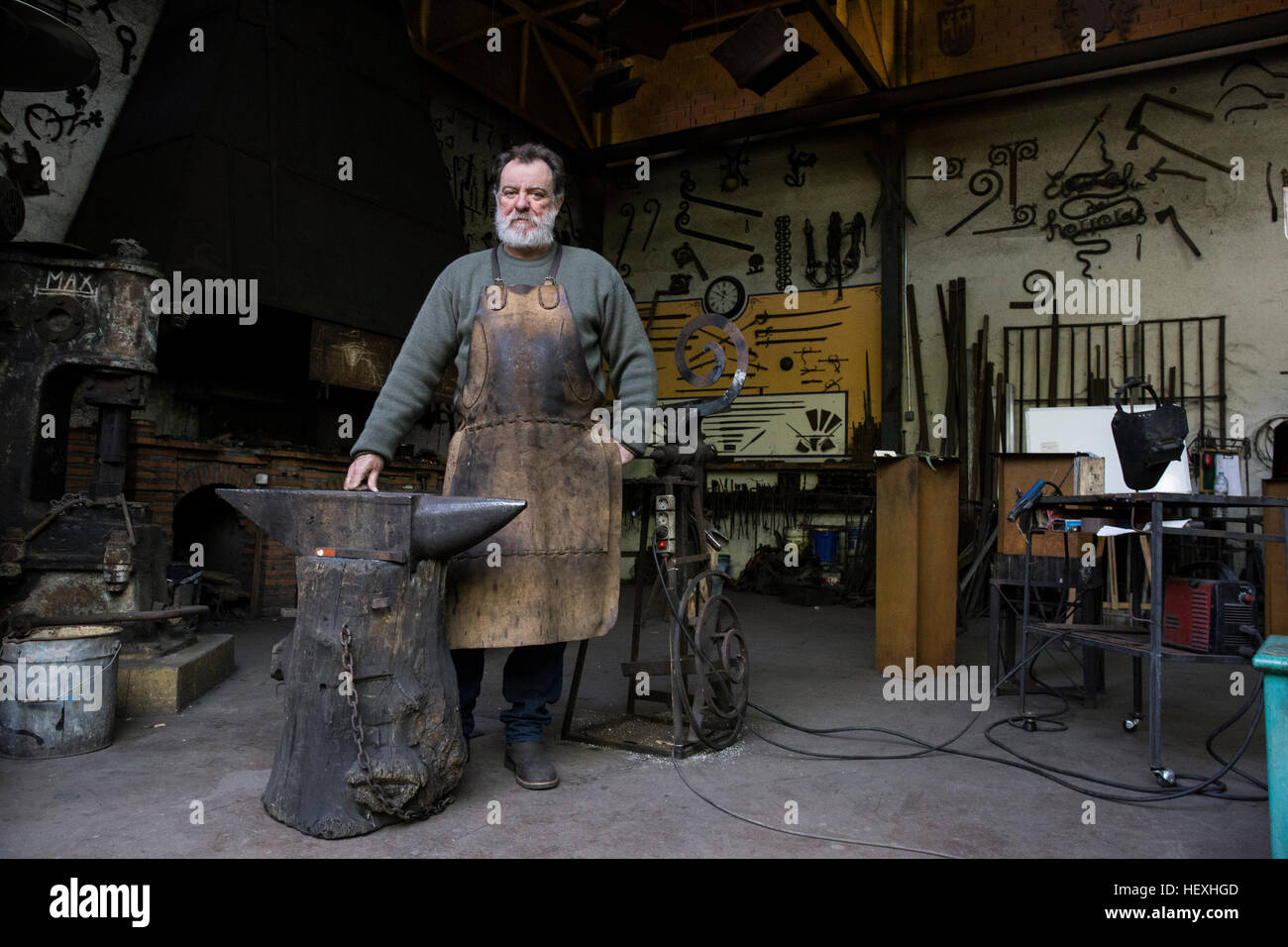 Portrait of confident blacksmith in his workshop Stock Photo - Alamy