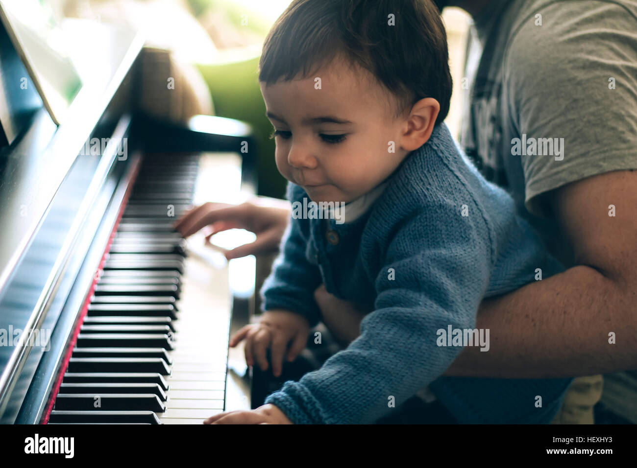 Child and his father playing piano Stock Photo - Alamy