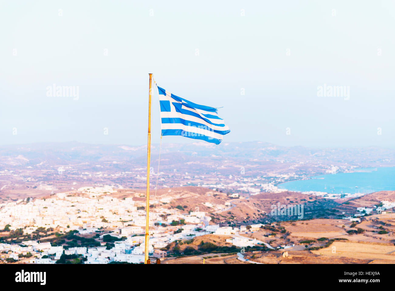 Greece, Milos, Greek flag over Plaka Stock Photo - Alamy