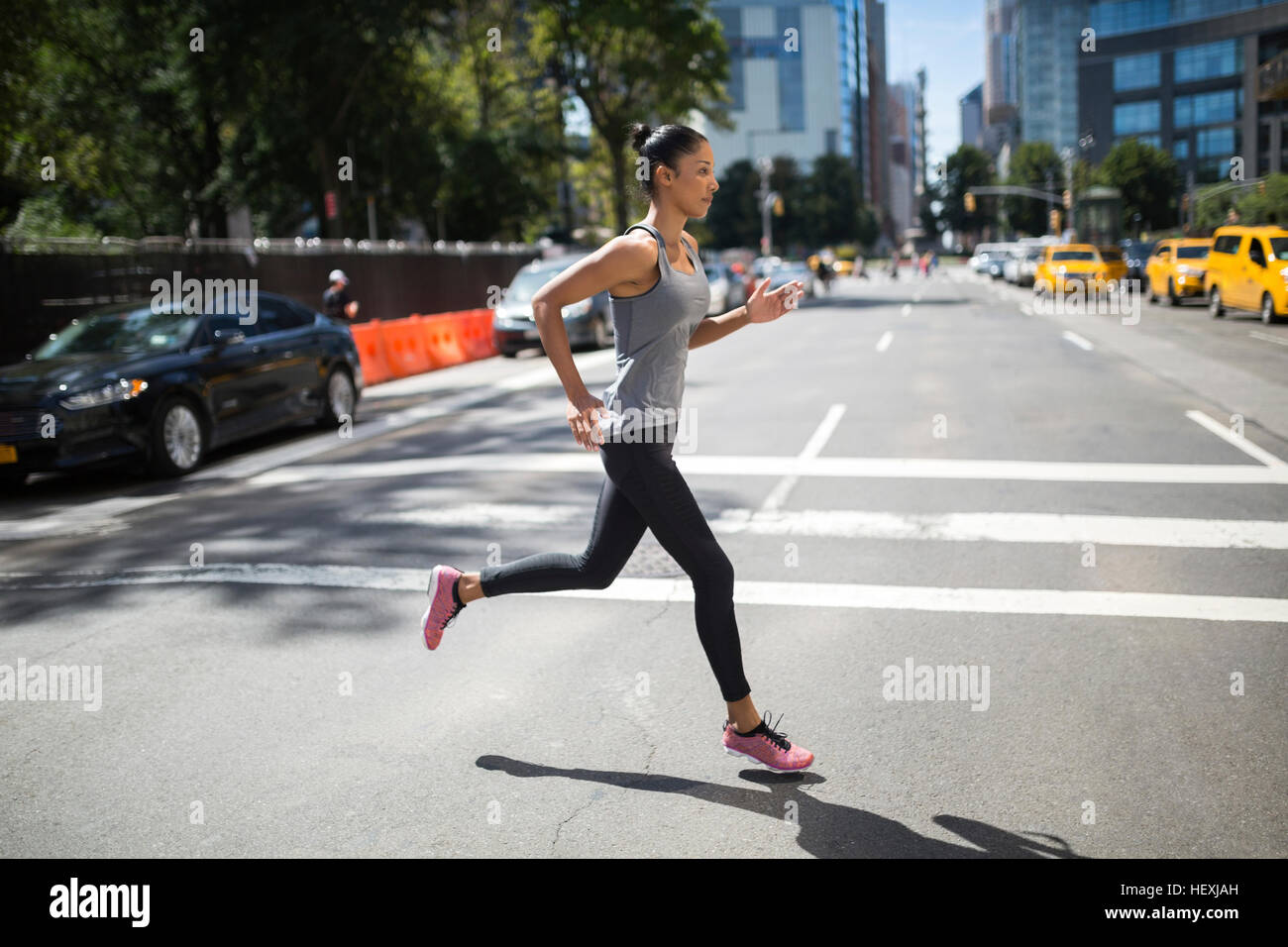 USA, New York City, woman running on urban street Stock Photo - Alamy