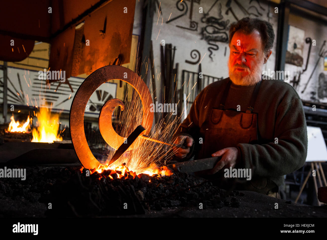 Blacksmith at work in his workshop Stock Photo - Alamy