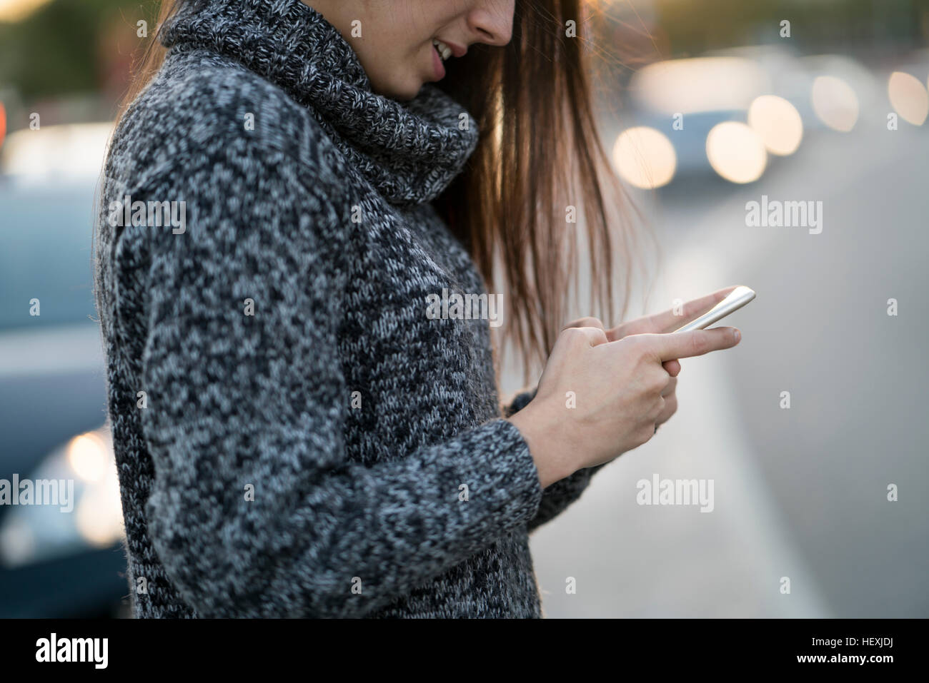 Woman using cell phone on the street Stock Photo - Alamy