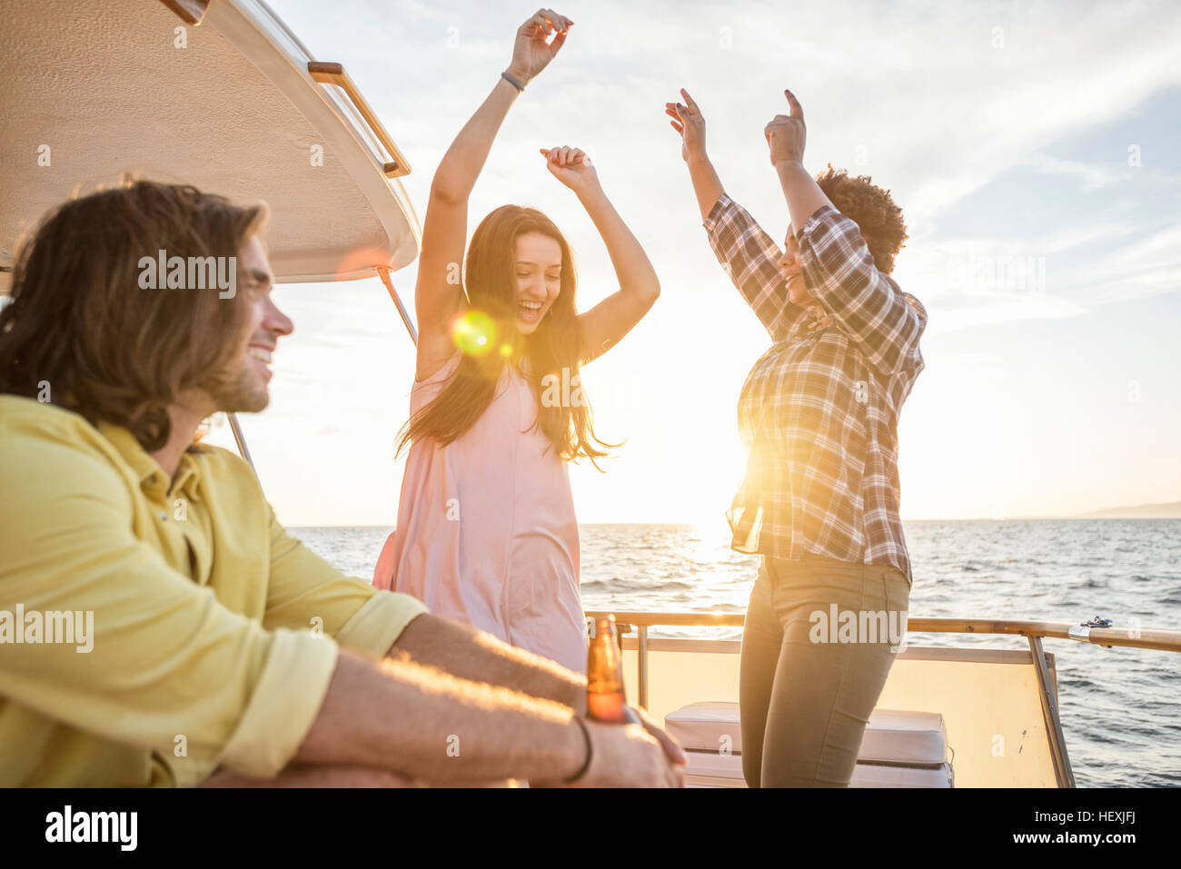 Happy friends having a party on a boat trip Stock Photo - Alamy