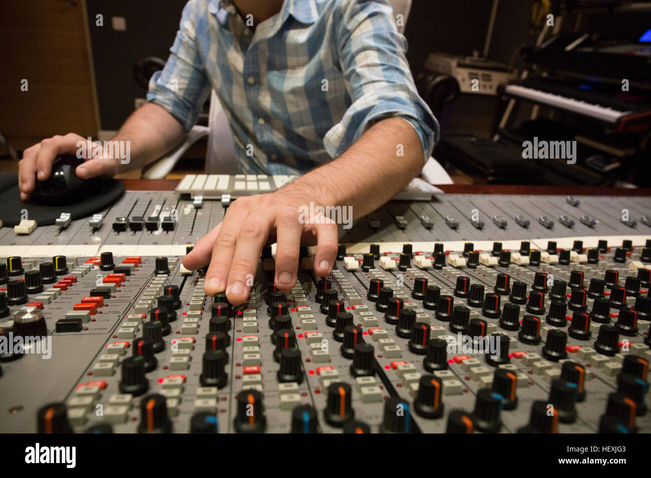 Hand of a man working in the control room of a recording studio Stock ...
