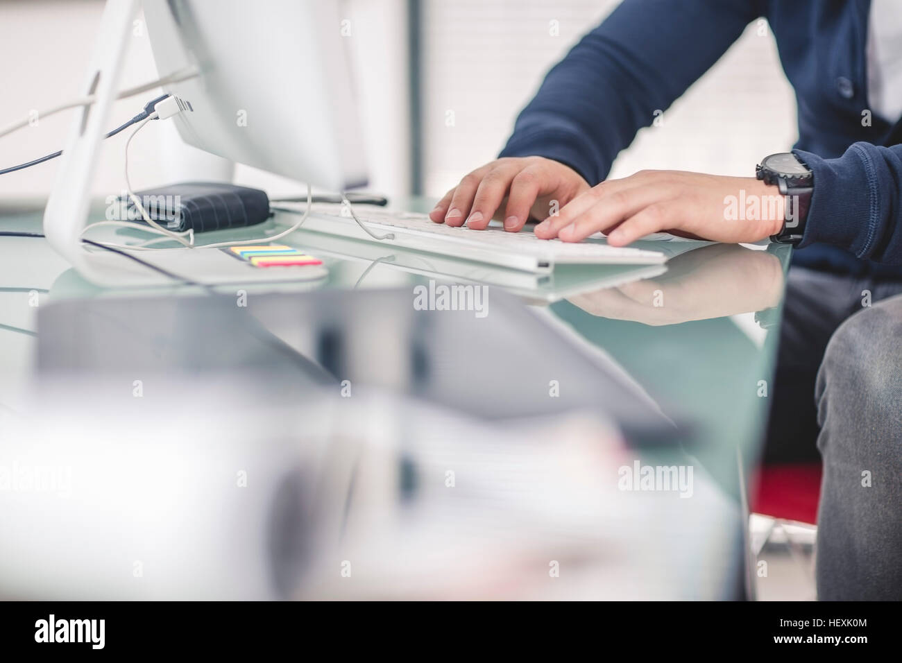 Man's hands typing on keyboard of computer in an office Stock Photo - Alamy