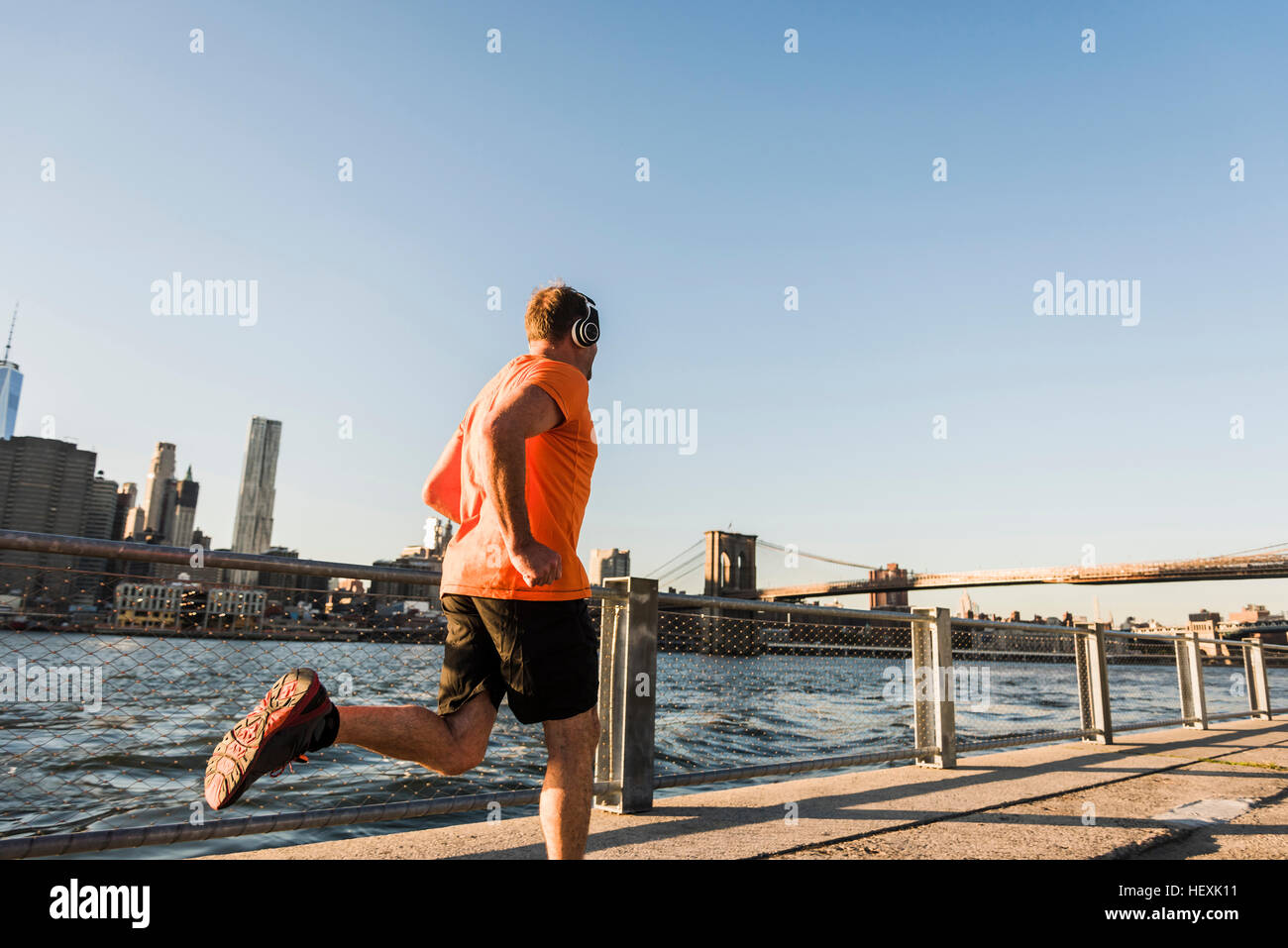 USA, Brooklyn, man jogging with headphones Stock Photo - Alamy