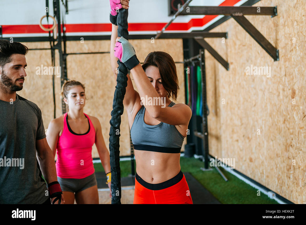 Climbing a rope in gym class hi-res stock photography and images - Alamy