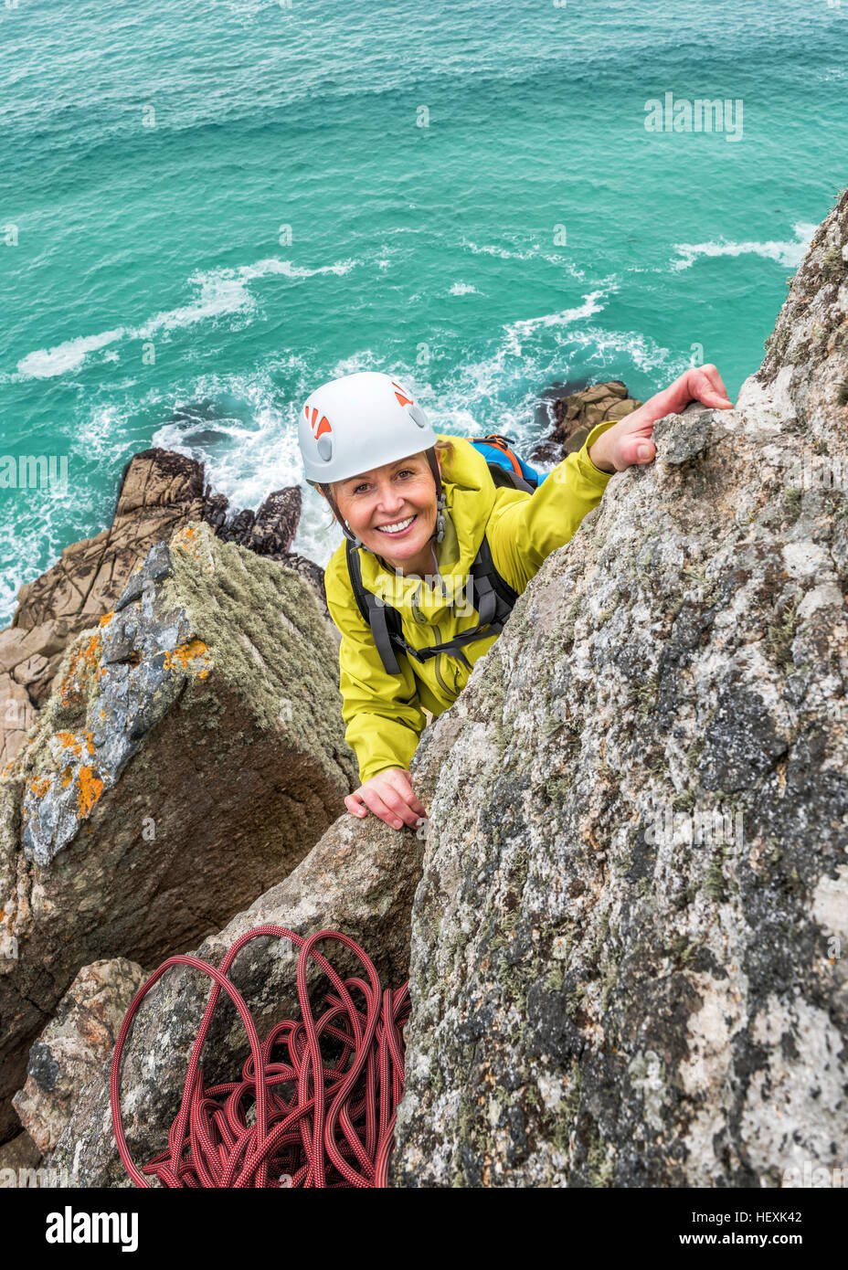 UK, Cornwall, smiling woman climbing on Commando Ridge Stock Photo - Alamy