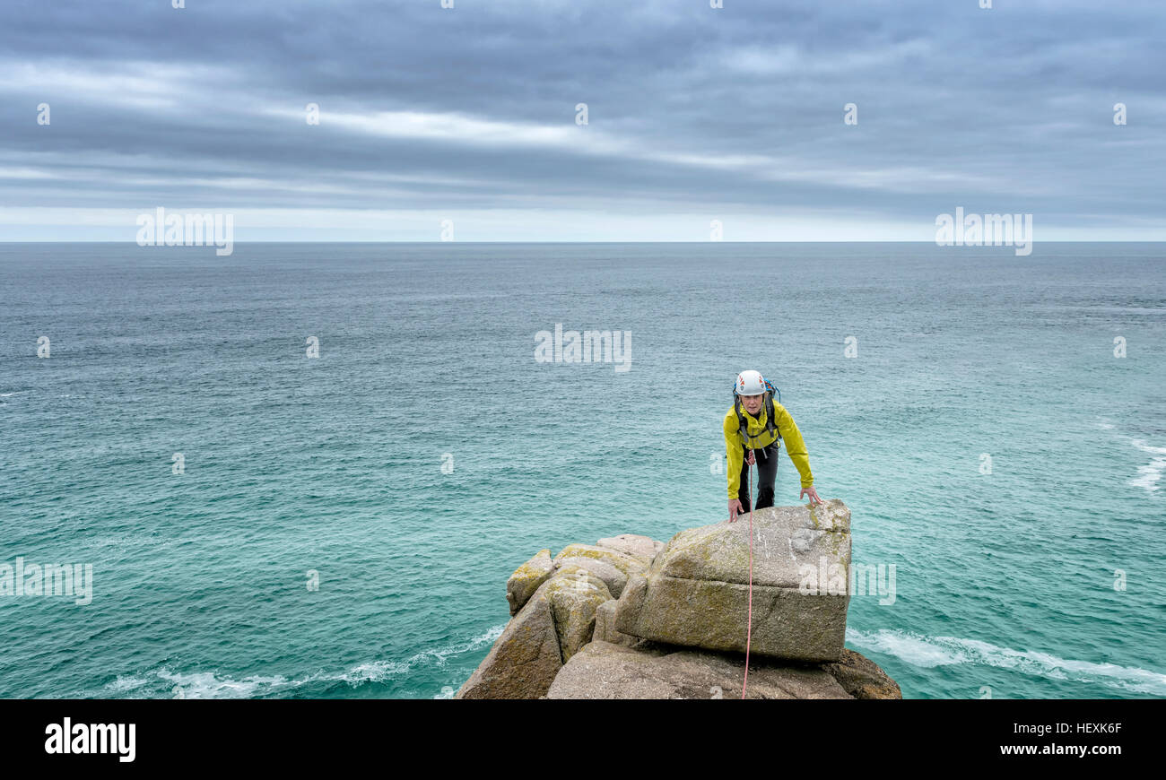 UK, Cornwall, woman on peak of Commando Ridge climbing route Stock ...