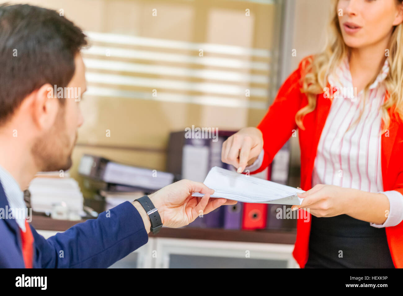 Handing Over Documents High Resolution Stock Photography and Images - Alamy
