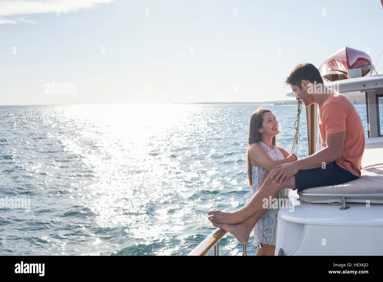 Young couple on a boat trip Stock Photo - Alamy