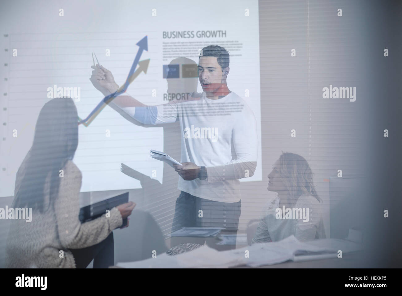 Business meeting in boardroom with chart projection Stock Photo - Alamy