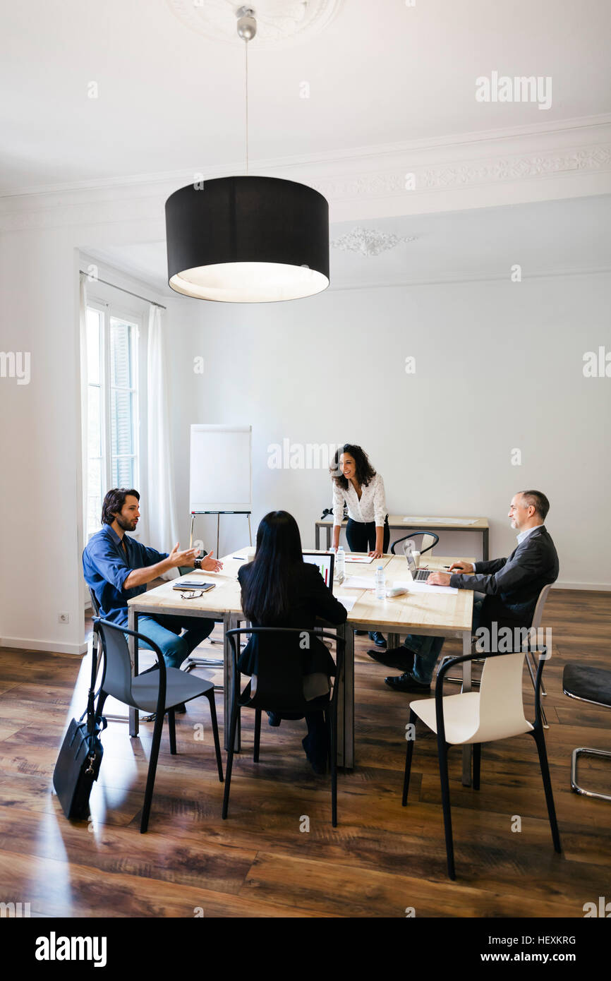 Business people having a team meeting in office Stock Photo - Alamy
