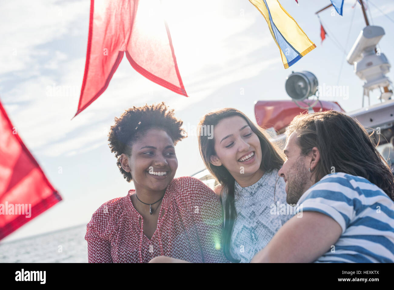 Happy friends on a boat trip Stock Photo - Alamy