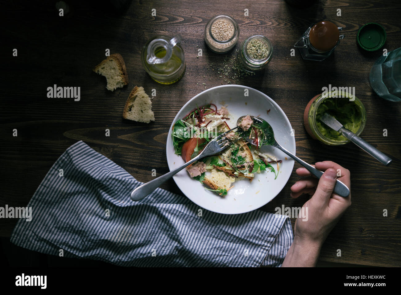Eating mixed salad with tuna Stock Photo - Alamy