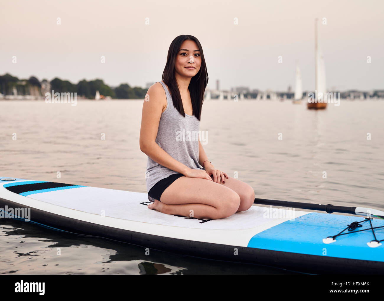 Asian woman paddleboard hi-res stock photography and images - Alamy