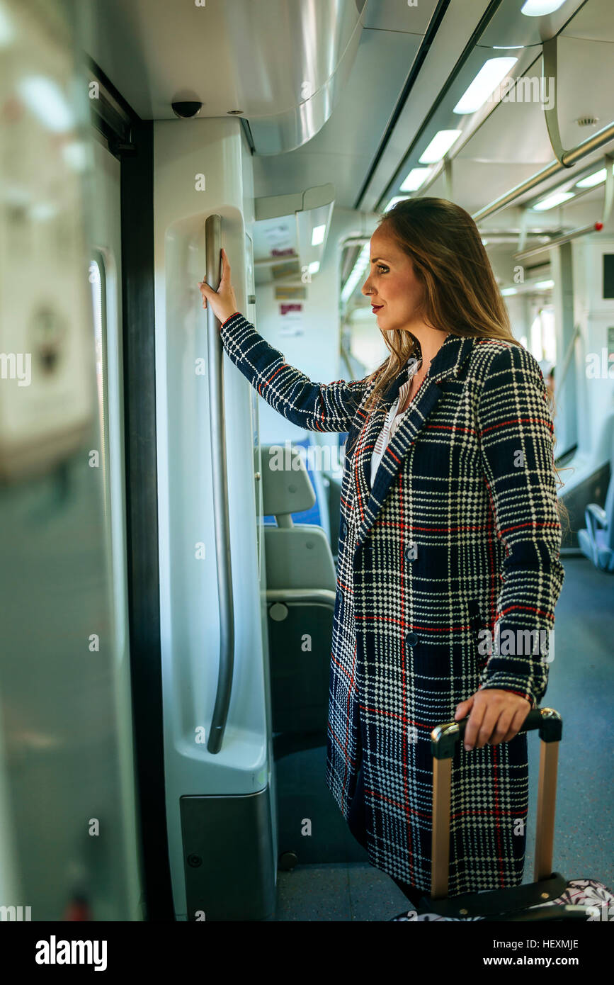 Woman in a train Stock Photo - Alamy