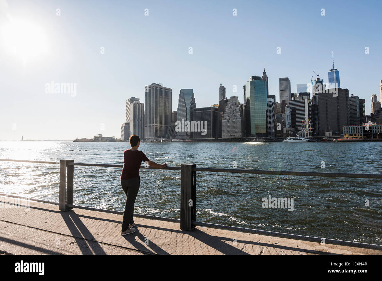 USA, Brooklyn, back view of woman looking at Manhattan skyline Stock ...