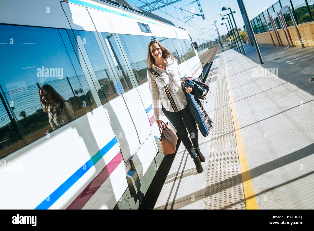 Businesswoman walking on platform hi-res stock photography and images ...